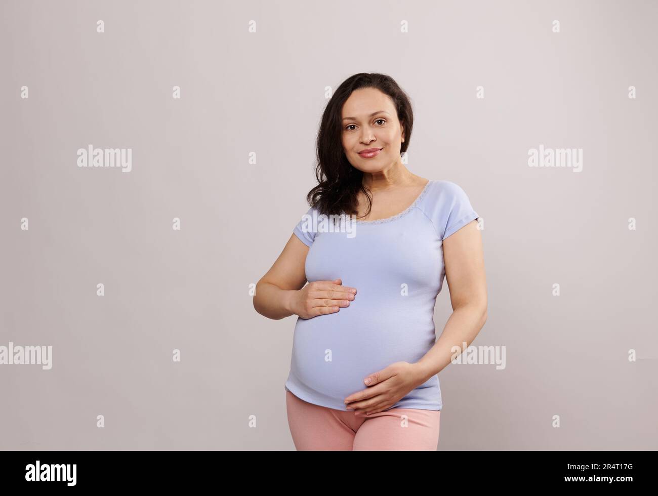 Portrait of beautiful adult pregnant woman, gravid expectant mother ...