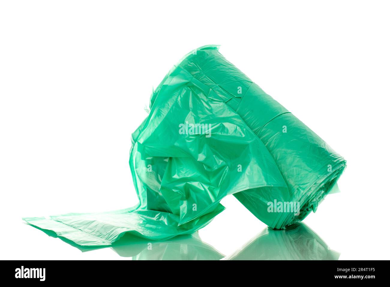 One pack of plastic trash bags, macro, isolated on white background ...