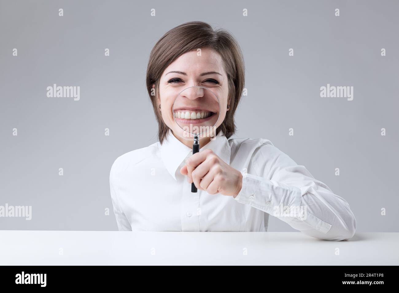 Woman exaggerates smile, big teeth Stock Photo - Alamy