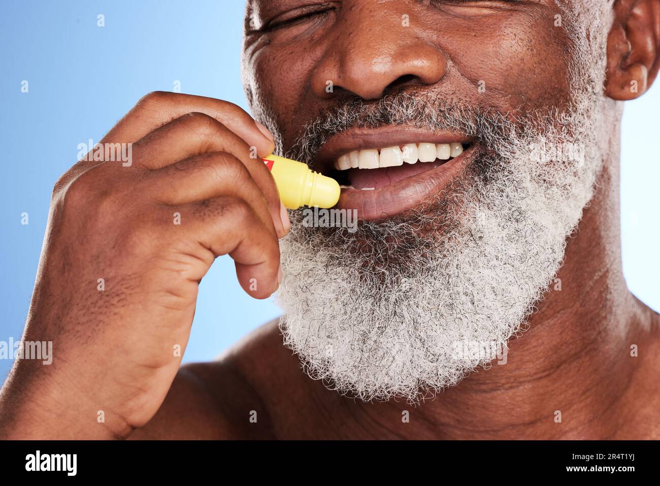 Skincare, lip balm and black man with cosmetics, smile and dermatology ...