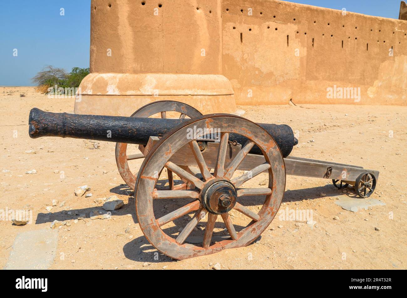 Cannon in front of the historical Al Zubarah fort in Qatar with an ...