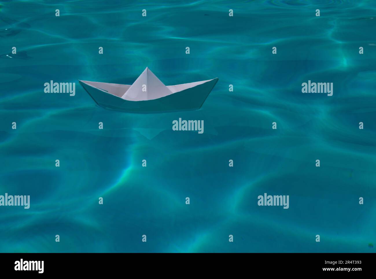 Cruise liner paper art. Paper boat sailing away on sea surface water ...