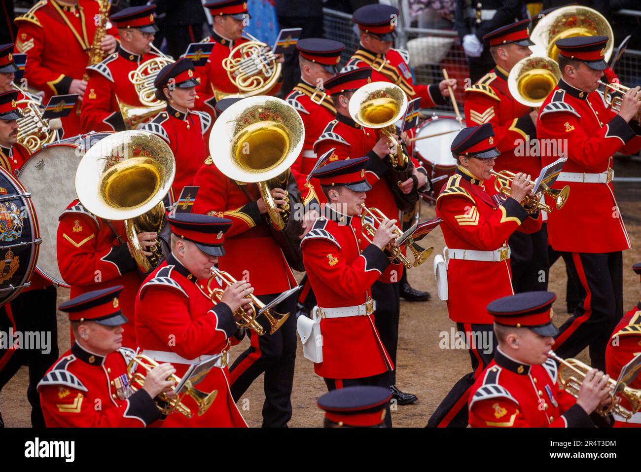 A marching band follow the Gold State Coach to Buckingham Palace after ...