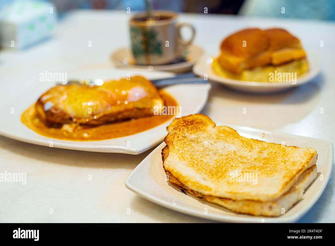 Eggs, toast with Kaya and Butter and coffee, traditional breakfast meal ...
