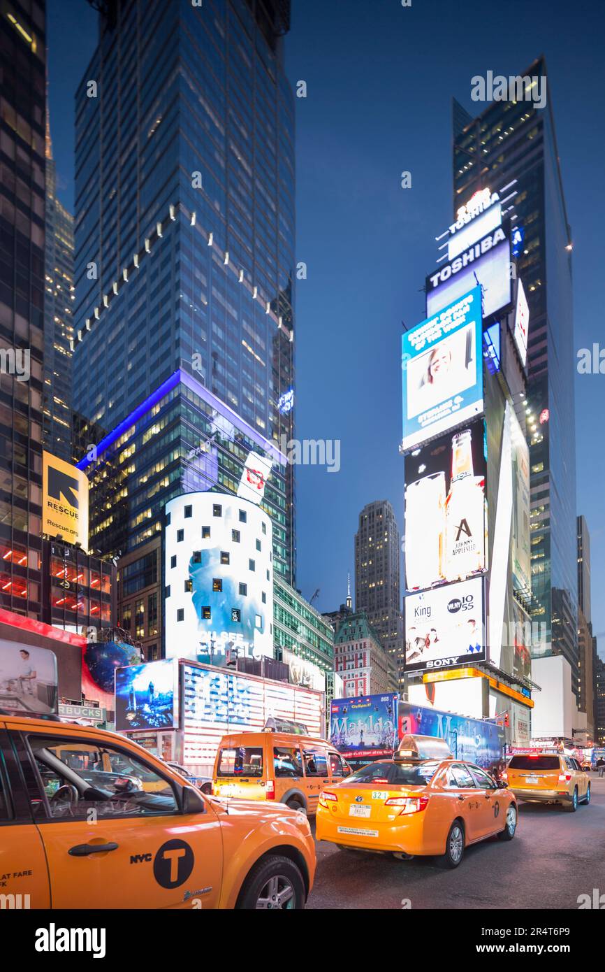 US, New York, Times square with Neon lights and Yellow taxi cabs at night Stock Photo - Alamy