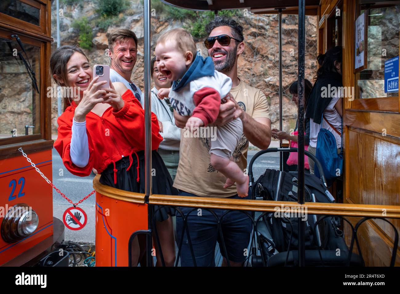 Family of Tourists inside the vintage tram at the Port of Soller ...