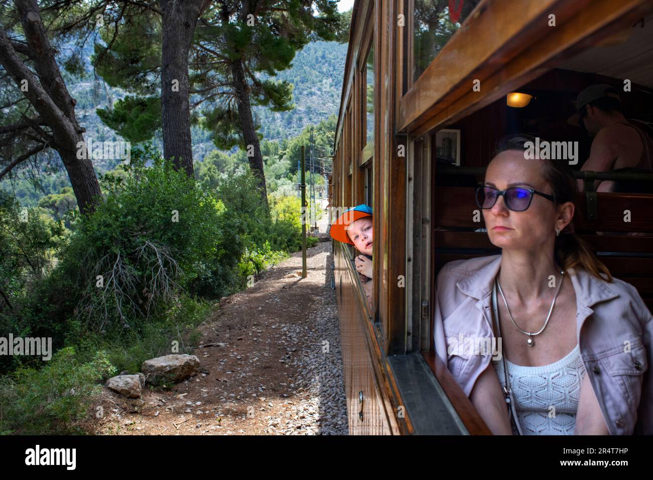 Tourists inside of tren de Soller train vintage historic train that ...