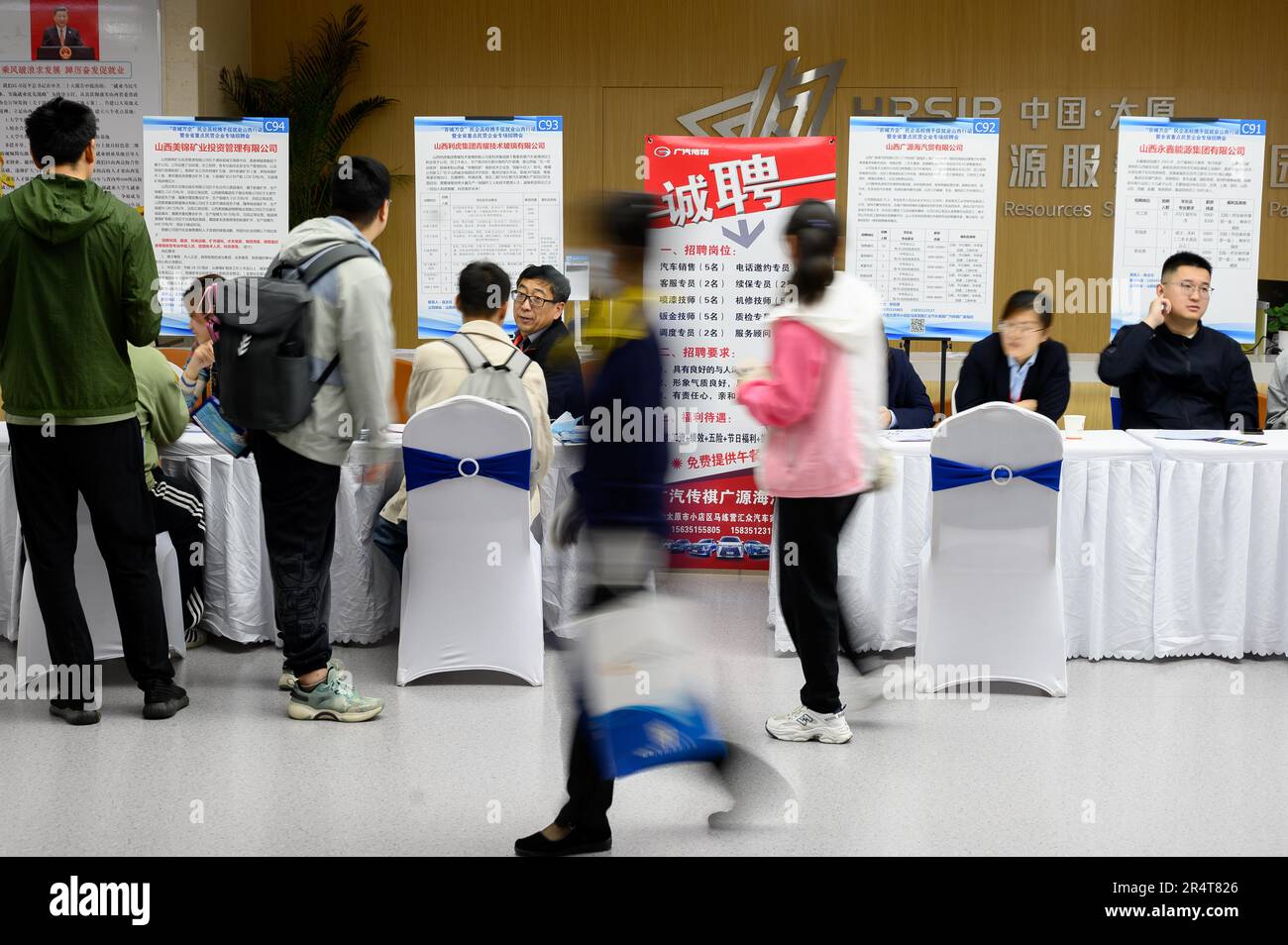College graduates look for jobs at a job fair in Taiyuan City, north ...