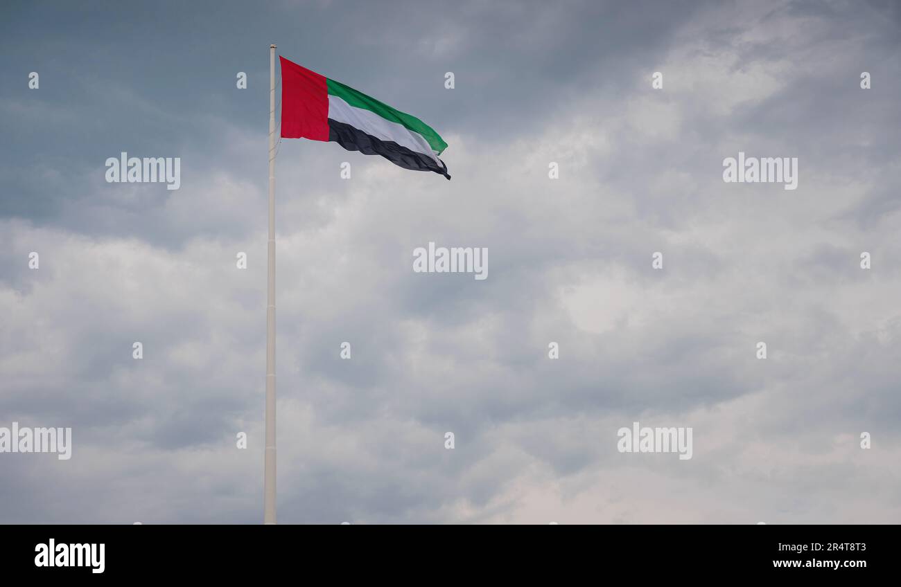 United Arab Emirates flag flying against sky. UAE celebrates it's ...