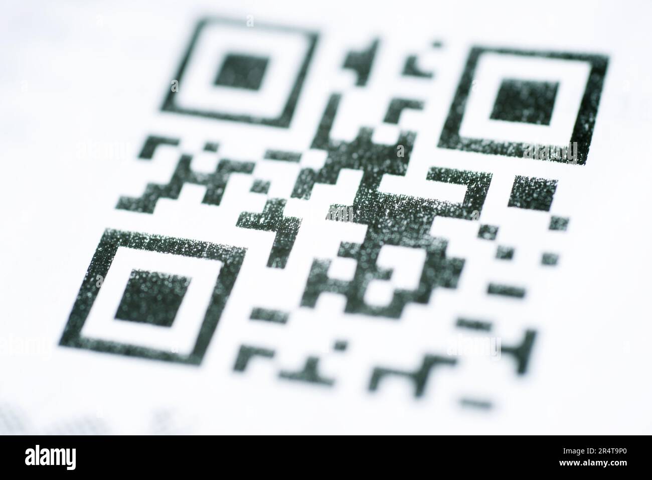 Close up of qr code printed on white paper Stock Photo - Alamy