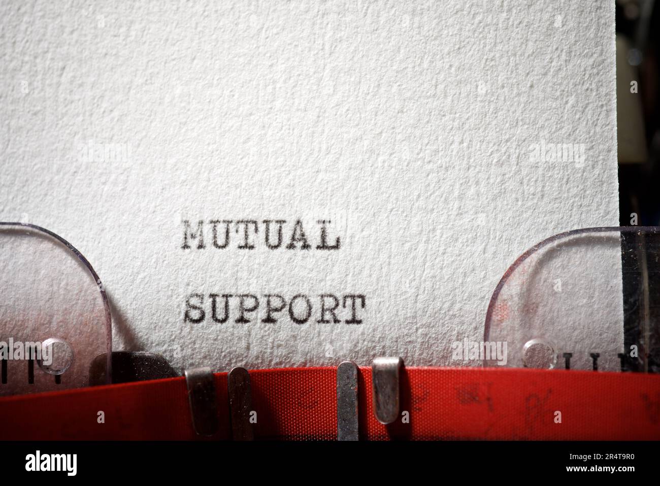 Mutual support text written with a typewriter Stock Photo - Alamy