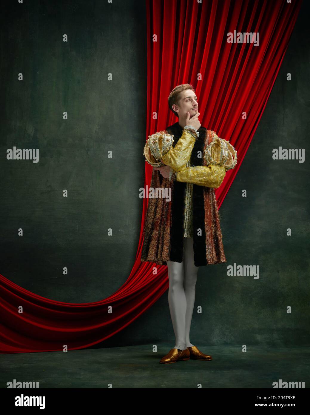 Portrait of thoughtful young man, prince, royal person in retro costume ...