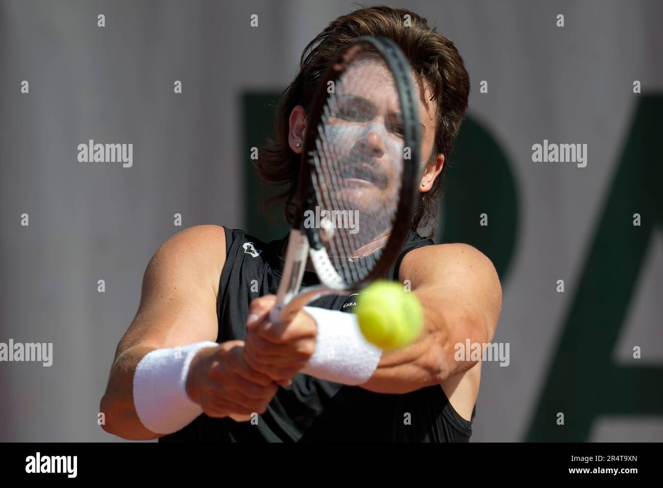 Jeffrey John Wolf of the U.S. plays a shot against Japan's Yoshihito ...