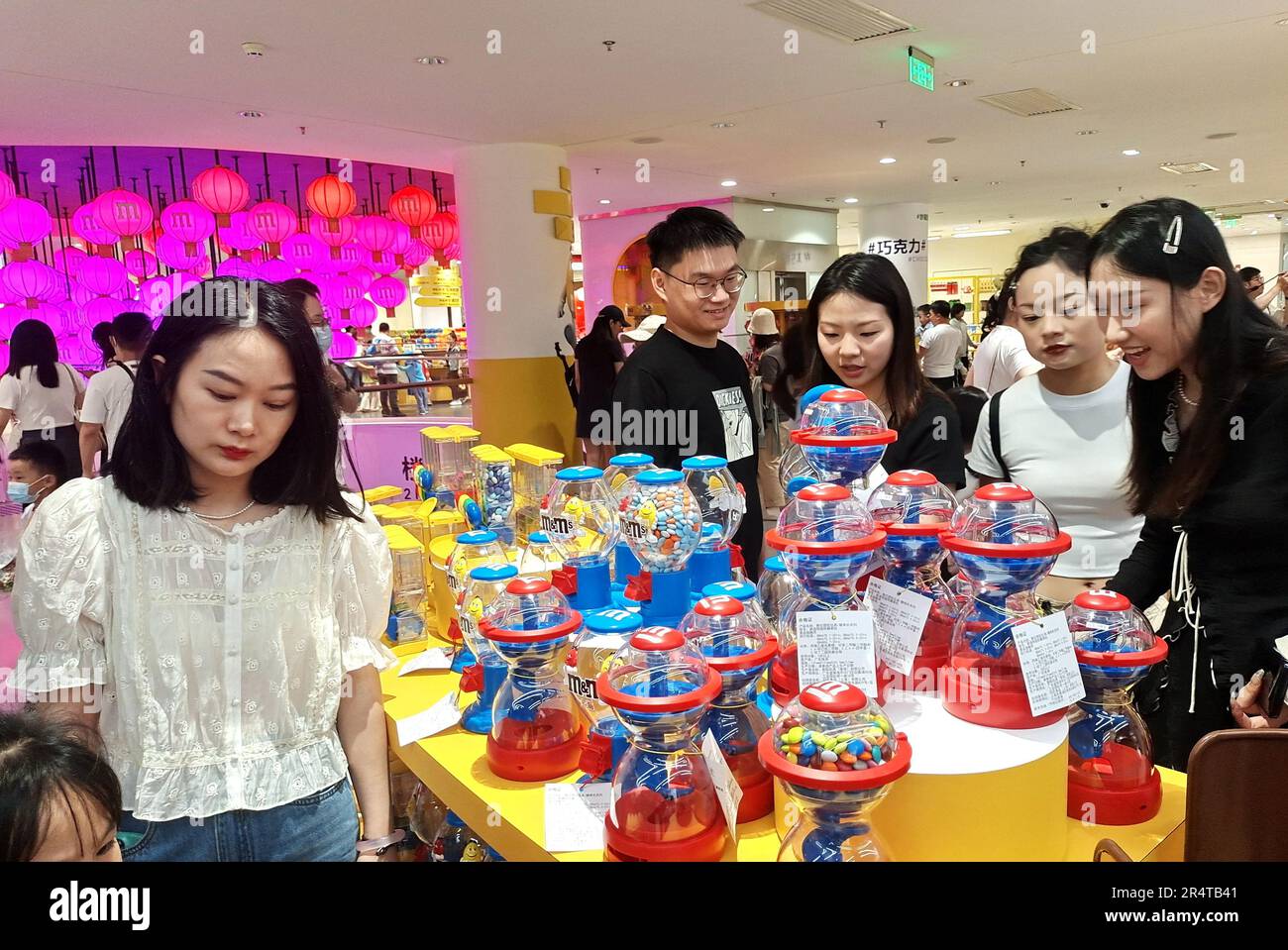 People shop at the M&M's Flagship Store in Shanghai, China, 27 May ...