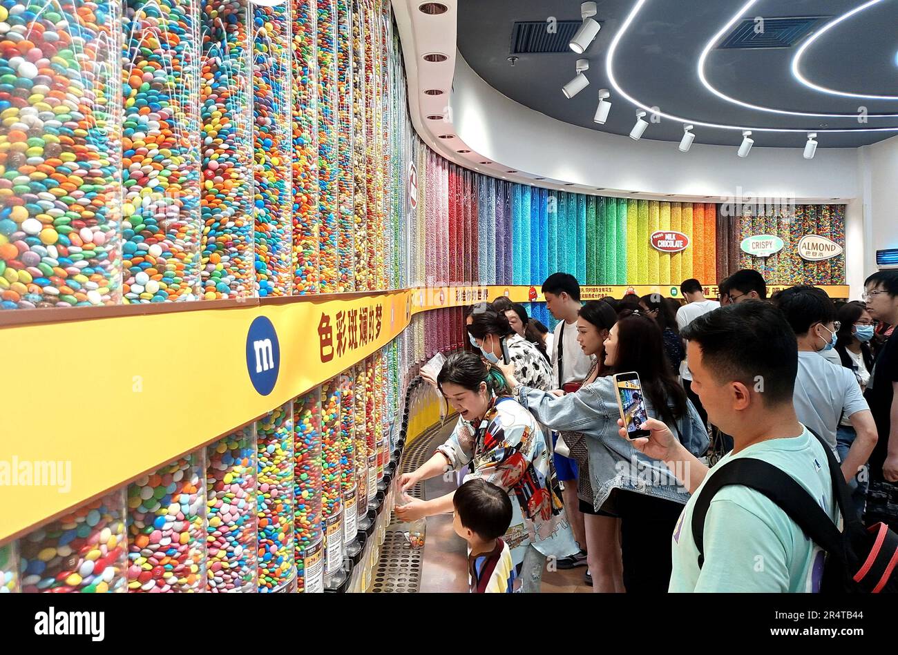 People shop at the M&M's Flagship Store in Shanghai, China, 27 May, 2023. (Photo by ChinaImages ...