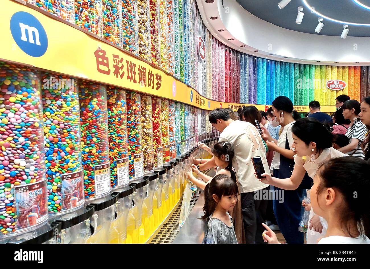 People shop at the M&M's Flagship Store in Shanghai, China, 27 May, 2023. (Photo by ChinaImages ...