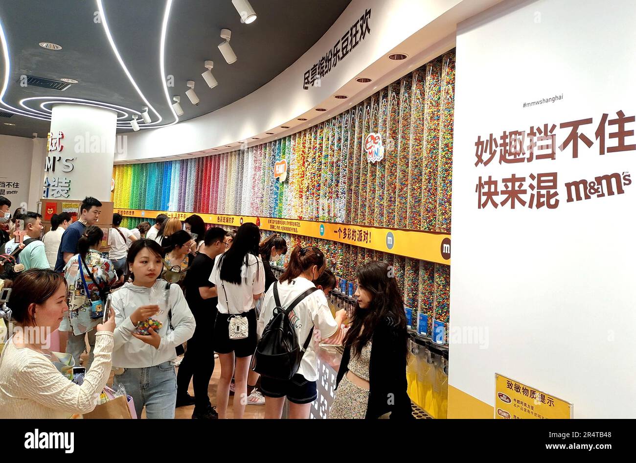 People shop at the M&M's Flagship Store in Shanghai, China, 27 May ...