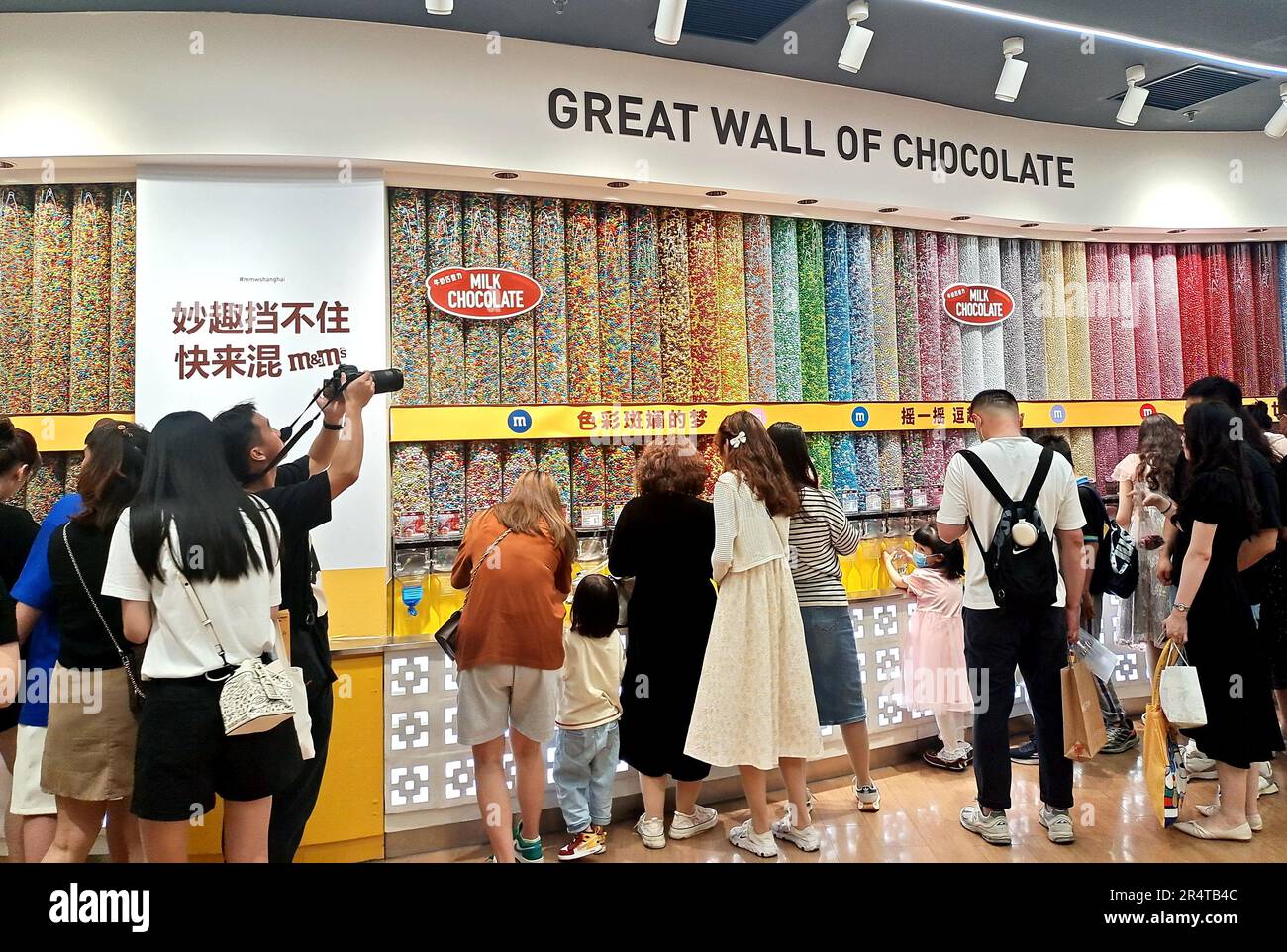 People shop at the M&M's Flagship Store in Shanghai, China, 27 May ...