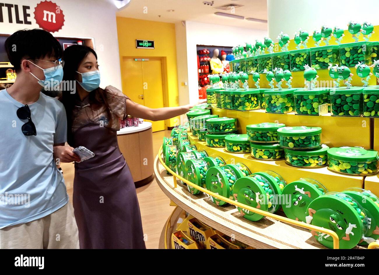People shop at the M&M's Flagship Store in Shanghai, China, 27 May ...