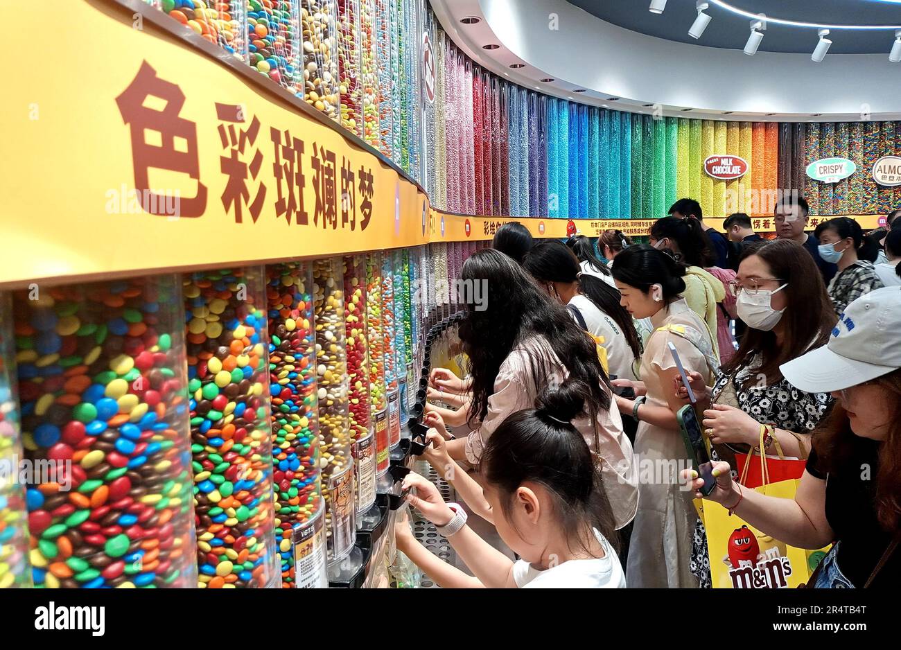 People shop at the M&M's Flagship Store in Shanghai, China, 27 May ...