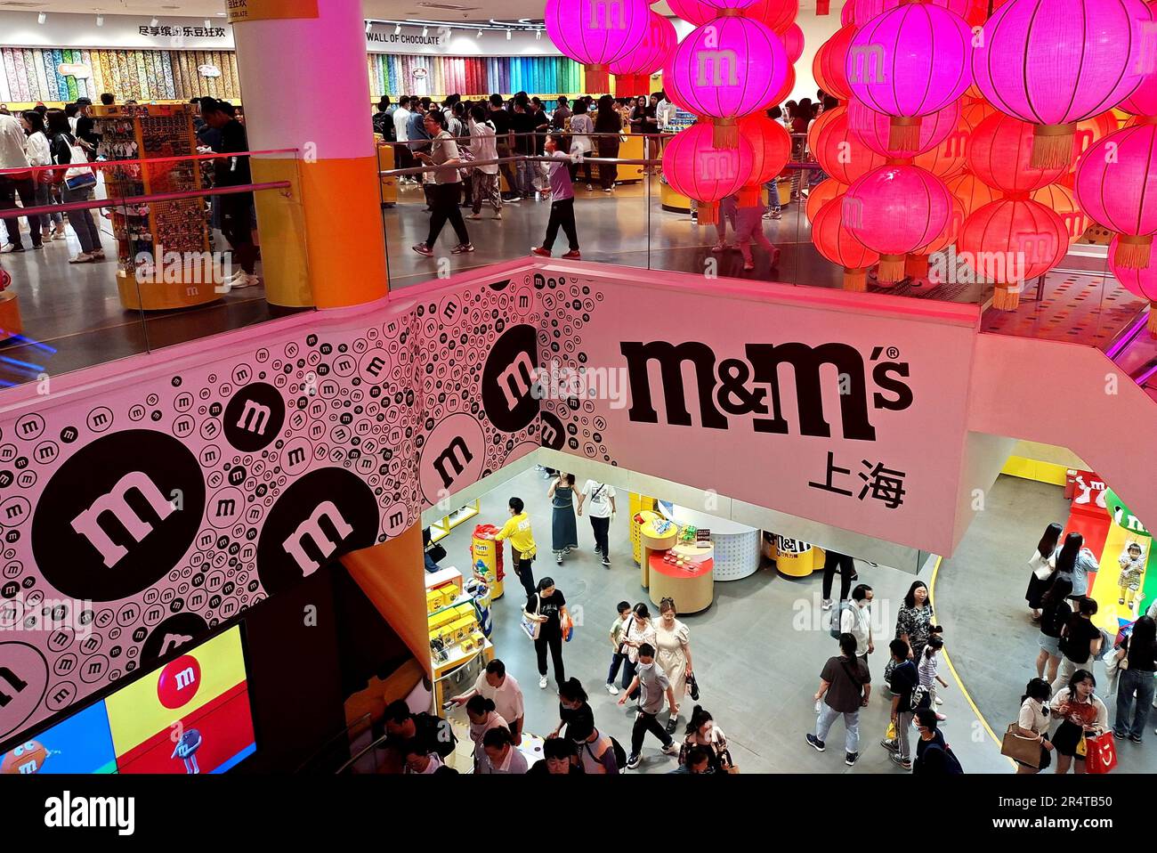 People shop at the M&M's Flagship Store in Shanghai, China, 27 May ...