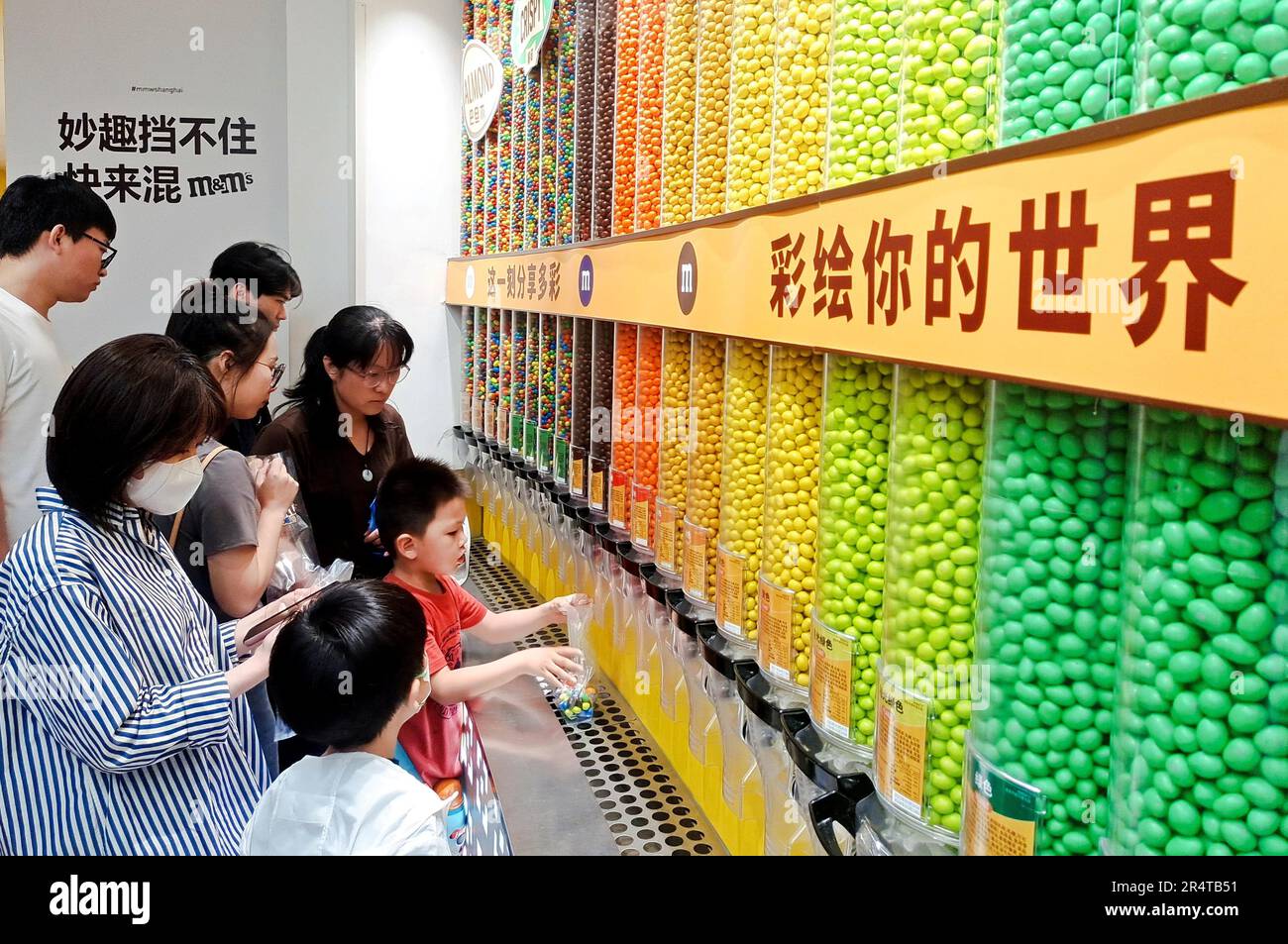 People shop at the M&M's Flagship Store in Shanghai, China, 27 May ...