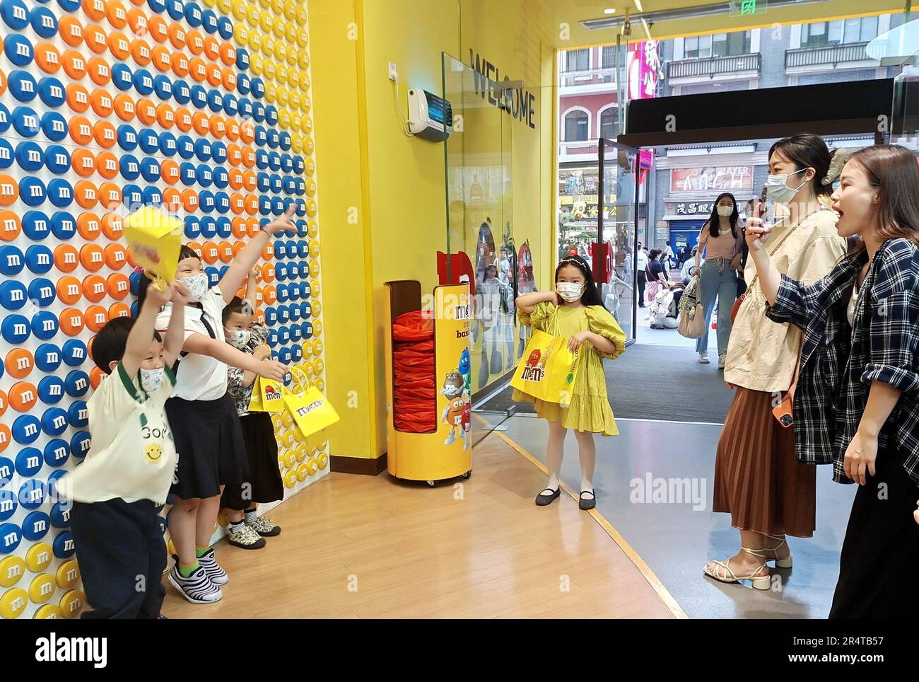 People shop at the M&M's Flagship Store in Shanghai, China, 27 May ...