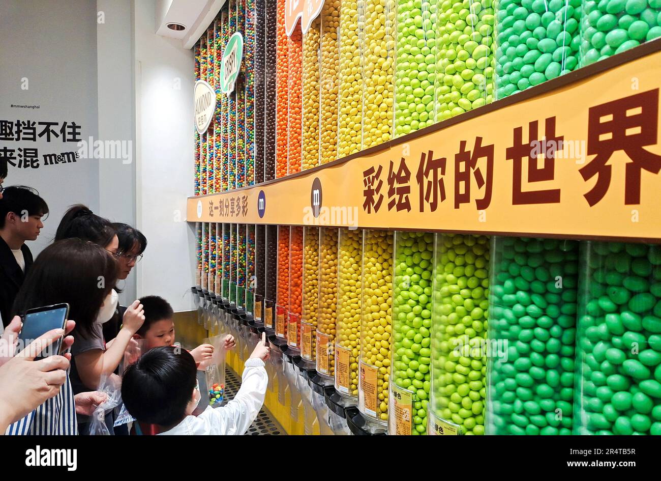 People shop at the M&M's Flagship Store in Shanghai, China, 27 May ...