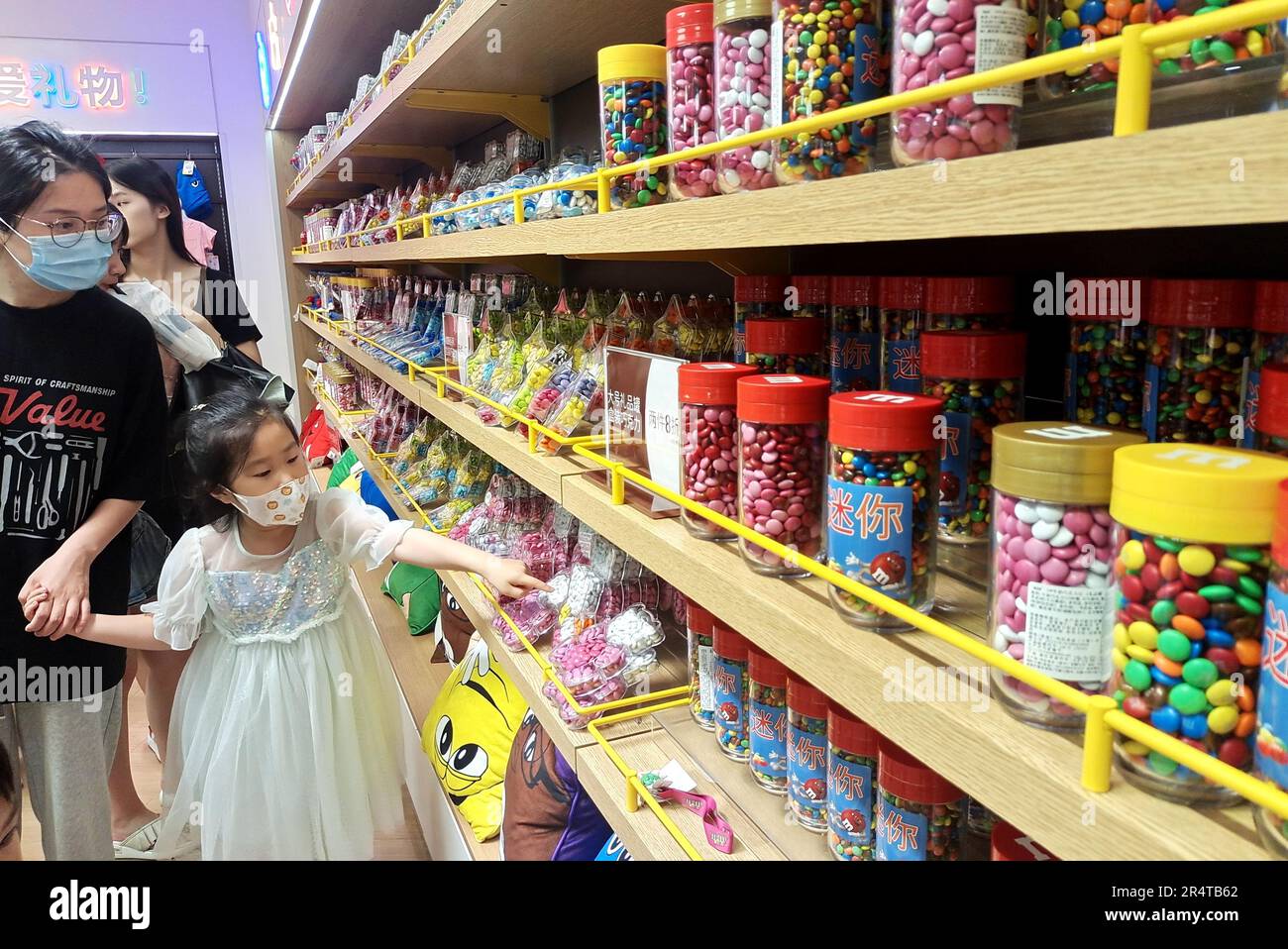 People shop at the M&M's Flagship Store in Shanghai, China, 27 May ...