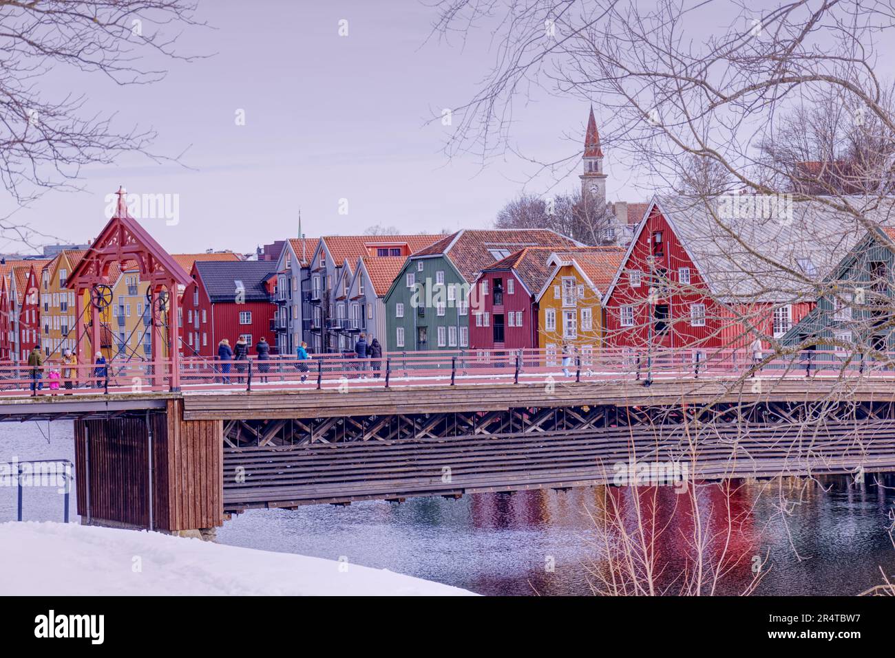 Bakklandet, Trondheim, Norway - Tourists walking across Old Town Bridge ...