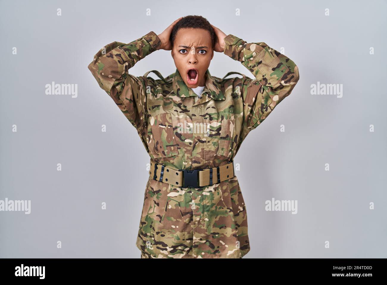 Beautiful african american woman wearing camouflage army uniform crazy ...