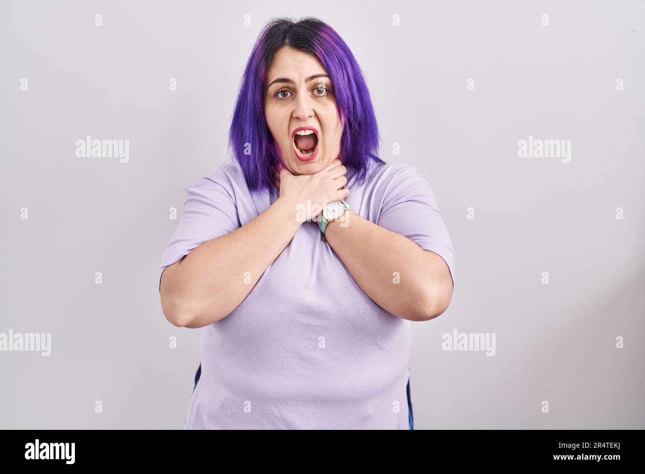 Plus size woman wit purple hair standing over isolated background ...