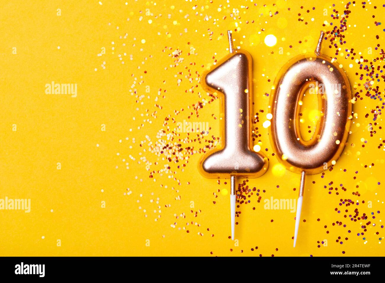 Gold candle in the form of number ten Stock Photo - Alamy