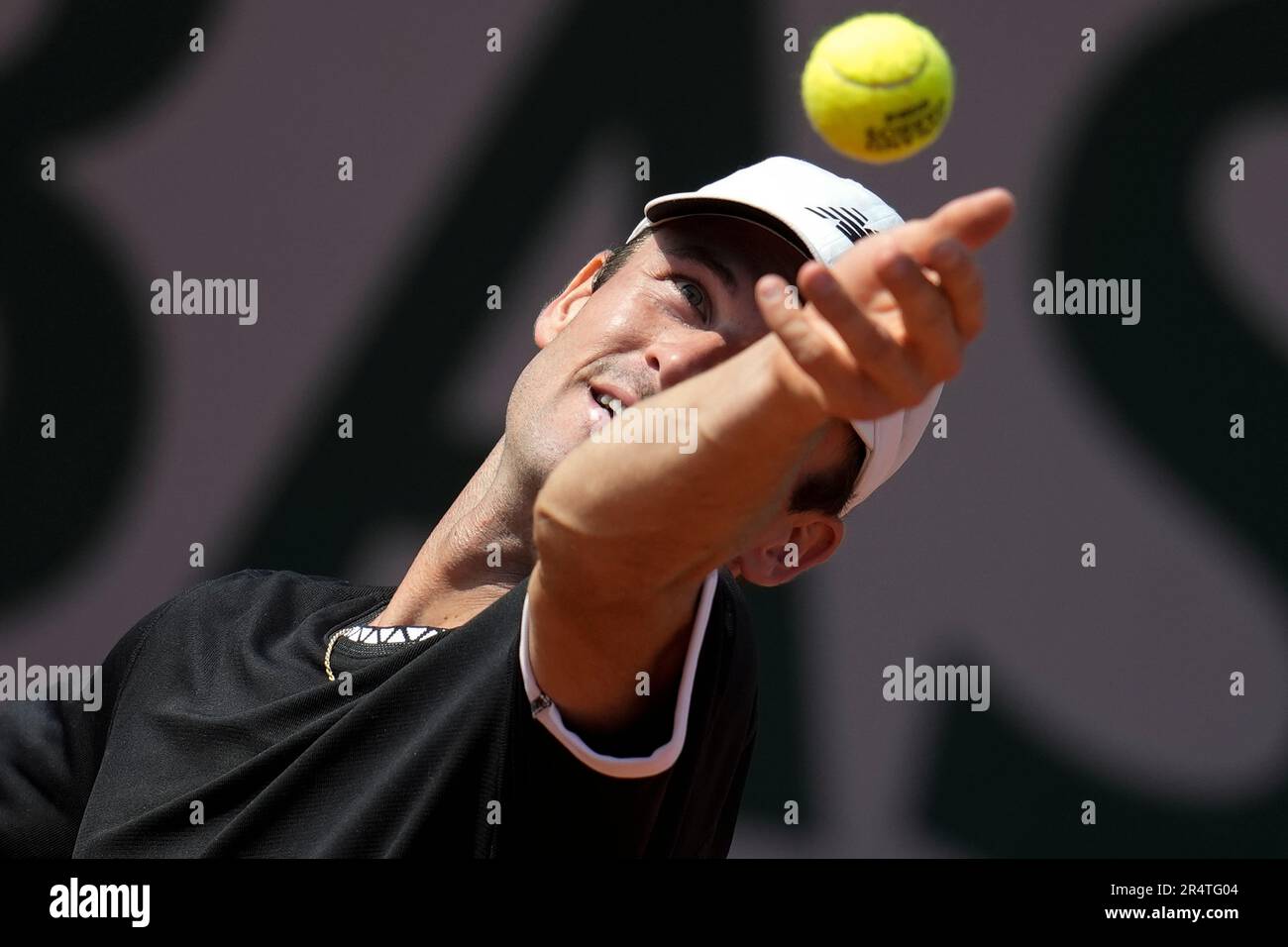 Tommy Paul of the U.S. serves against Switzerland's Dominic Stephan ...