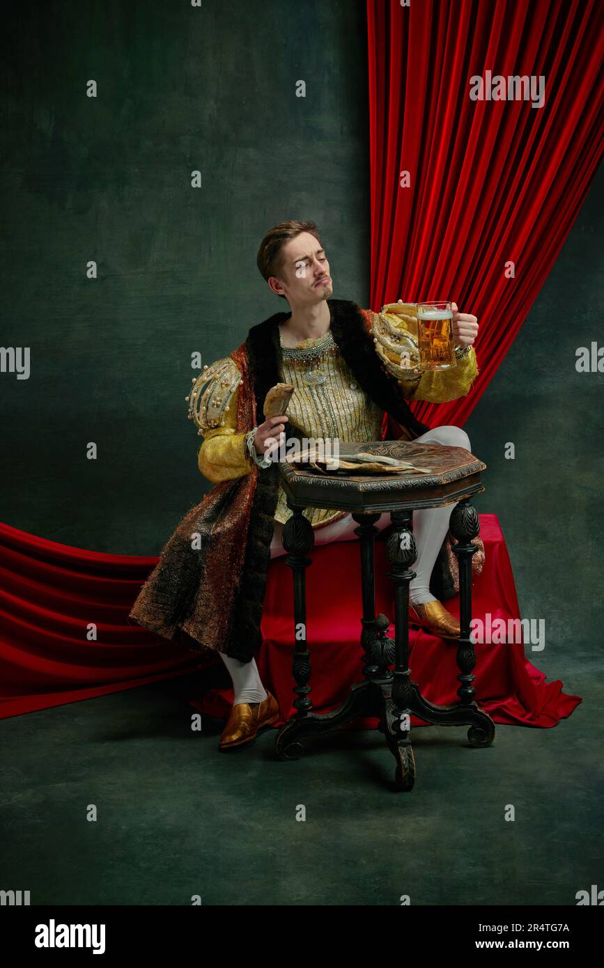 Young man in vintage clothing, royal person, princess sitting and ...