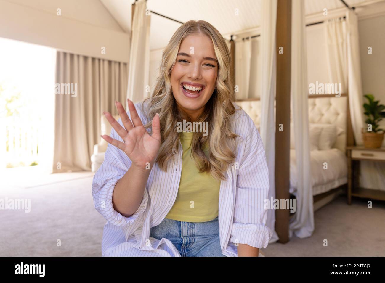 Young woman waving hand gesture hi-res stock photography and images - Alamy