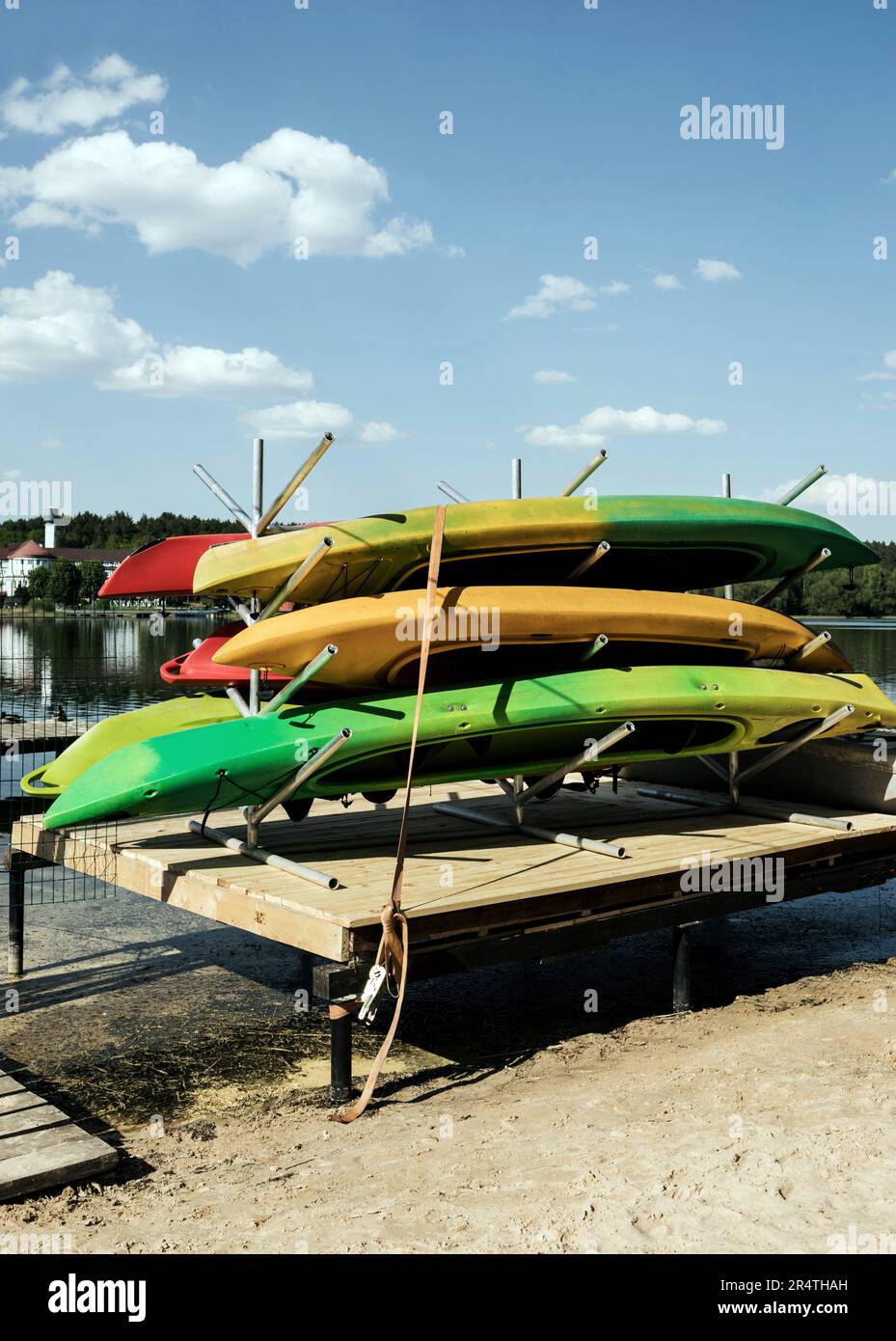 Row plastic kayaks on shore. tourism and vacations. active leisure ...