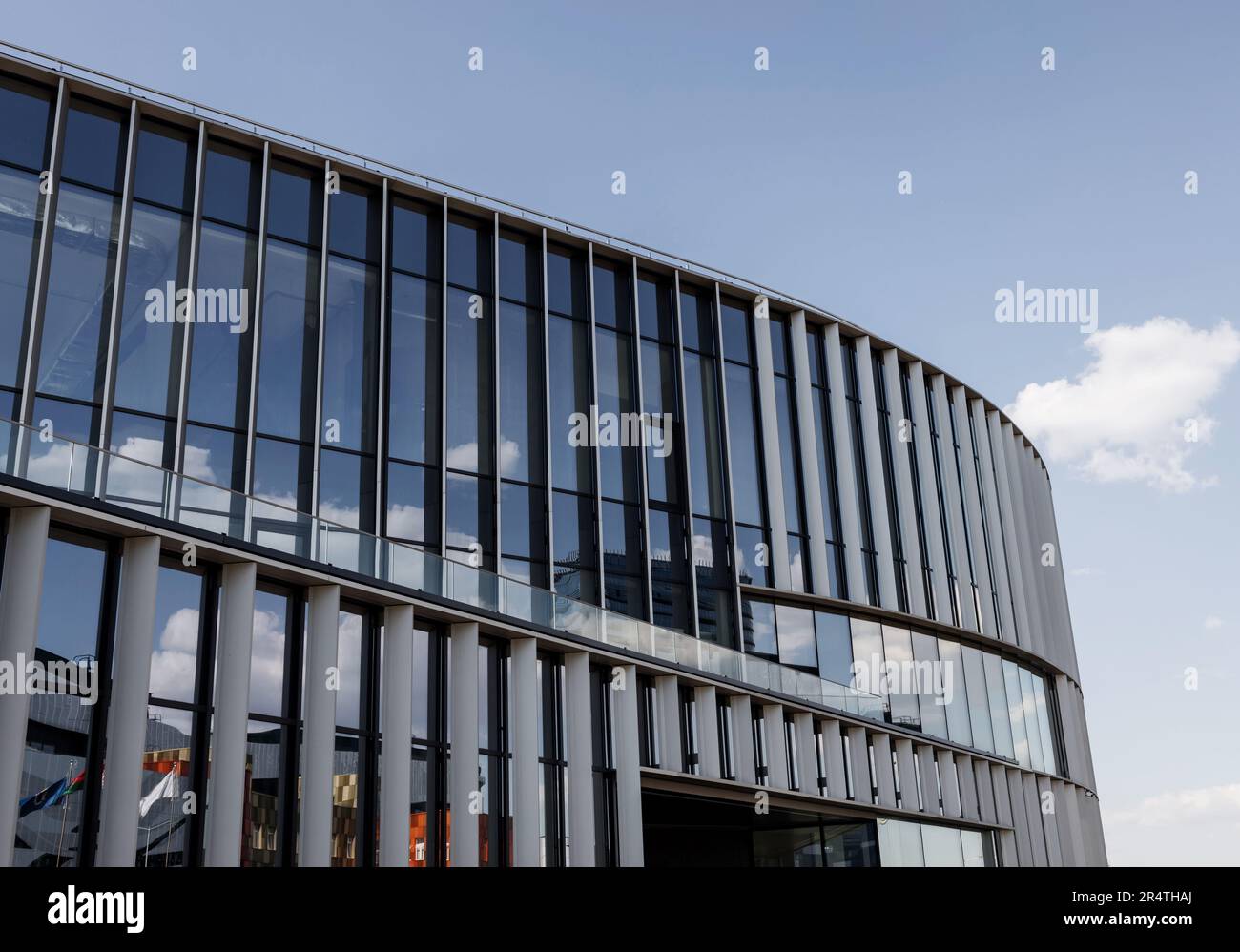 facade of a glass office building against the sky. financial center ...