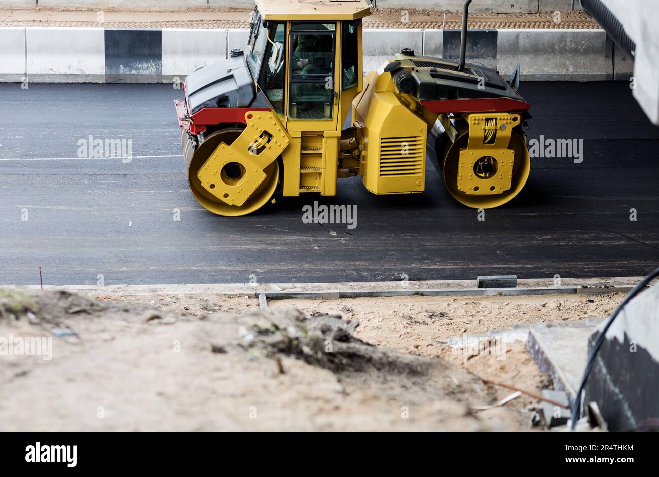 Asphalt paver machine on road repair site road renewal process. Heavy ...