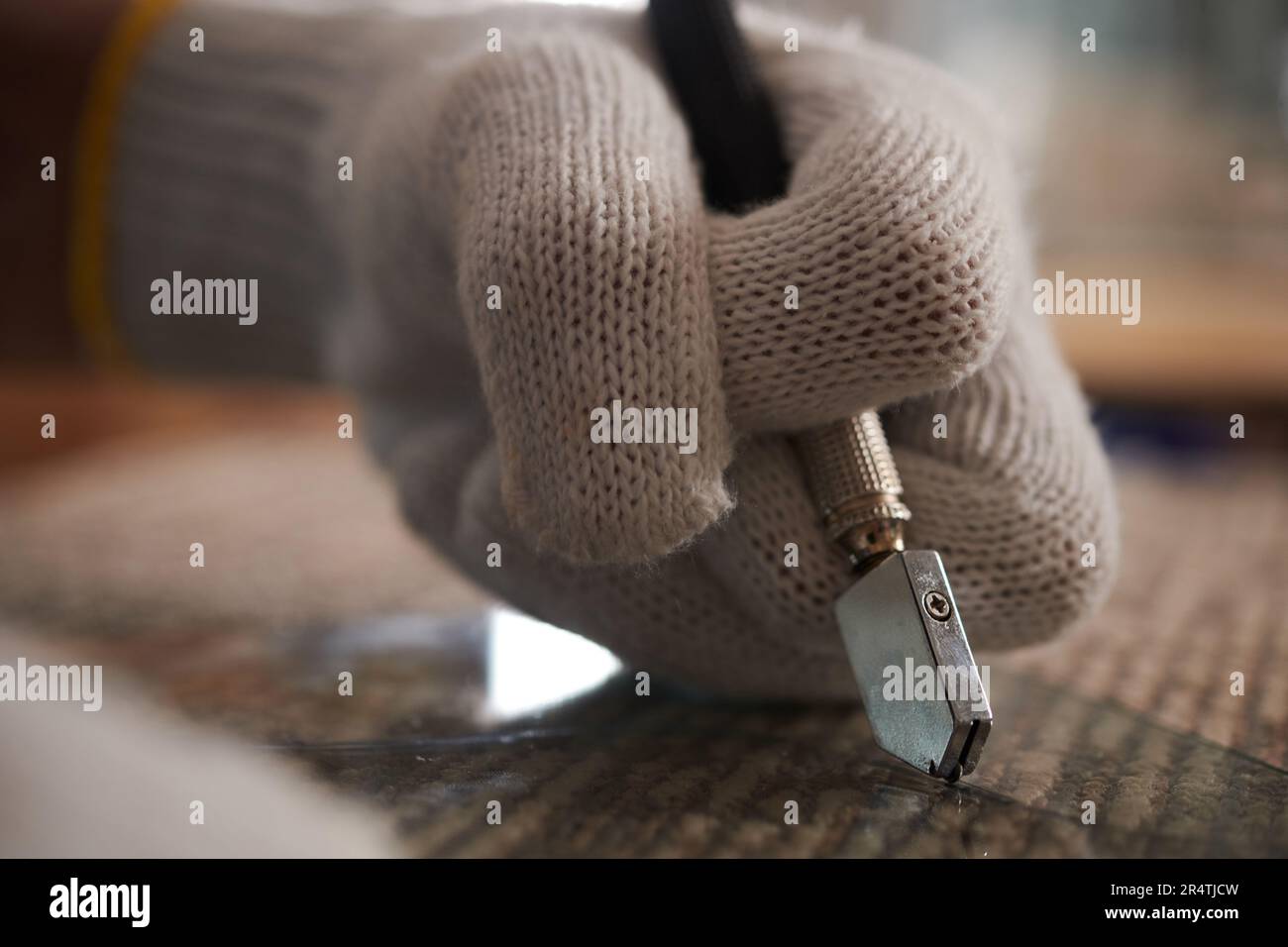 Process of cutting glass in small pieces for creative project Stock ...
