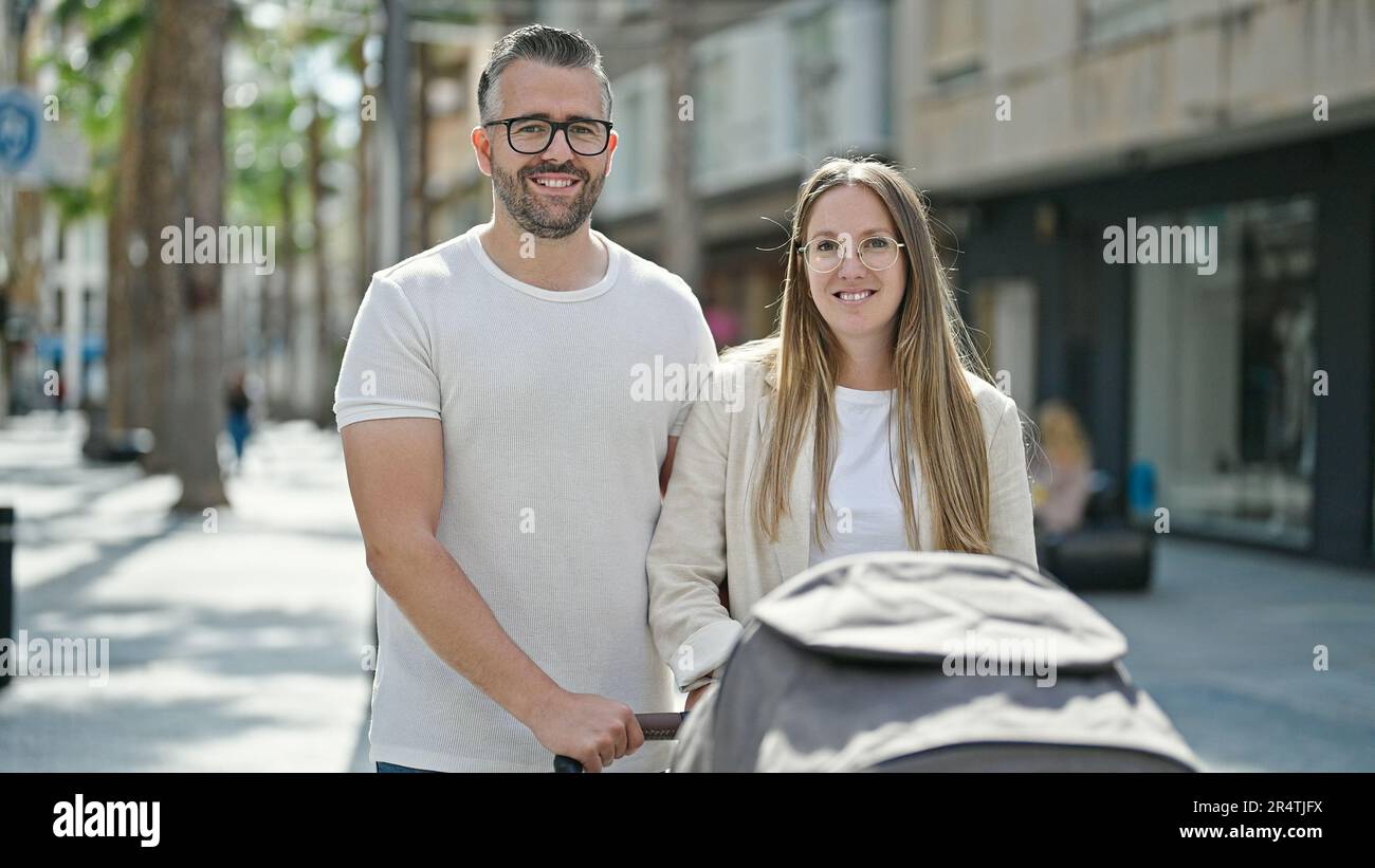 Woman with baby cart standing hi-res stock photography and images - Alamy
