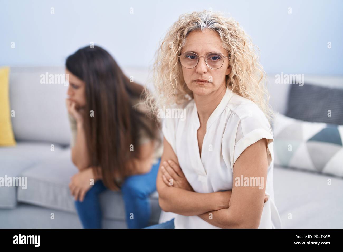 Two women mother and daughter arguing at home Stock Photo - Alamy