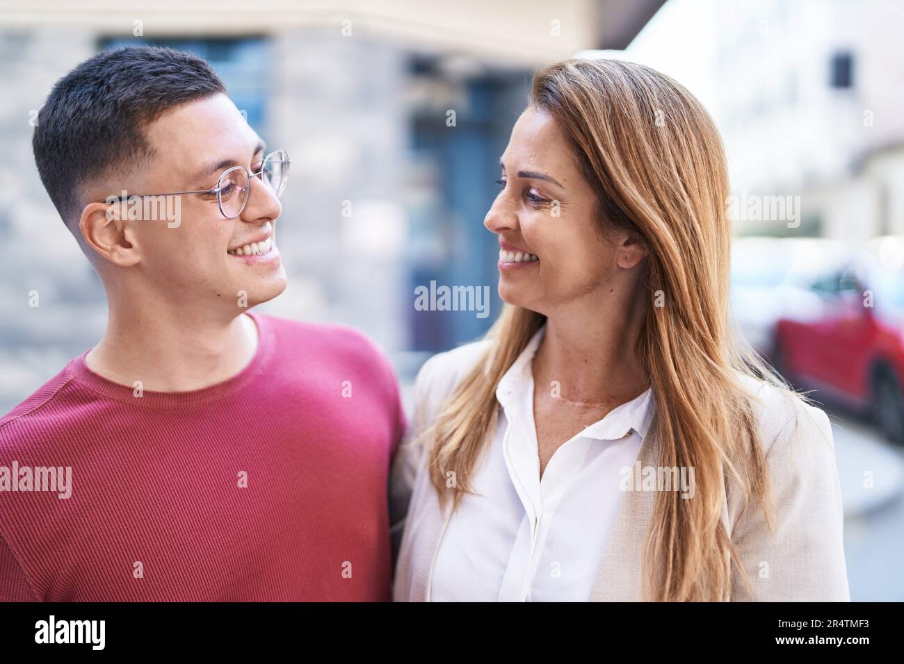 Man and woman mother and son standing together at street Stock Photo ...