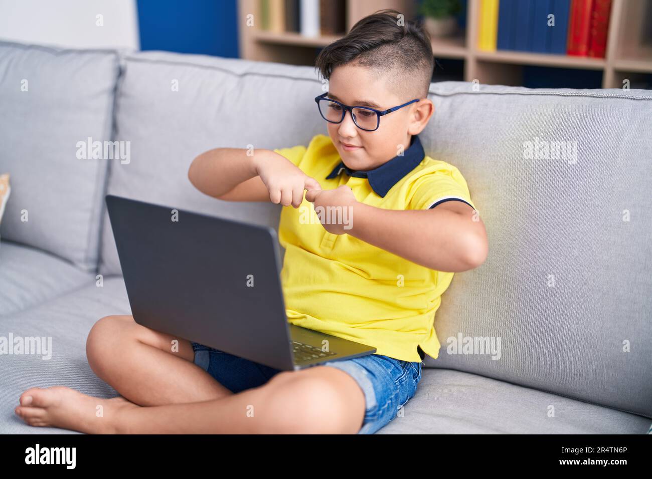 Adorable hispanic boy having video call communicate with sign deaf ...