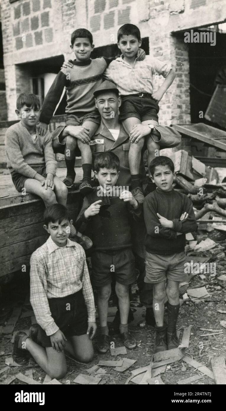 Group of children playing outside a cardboard factory, USA 1965 Stock ...