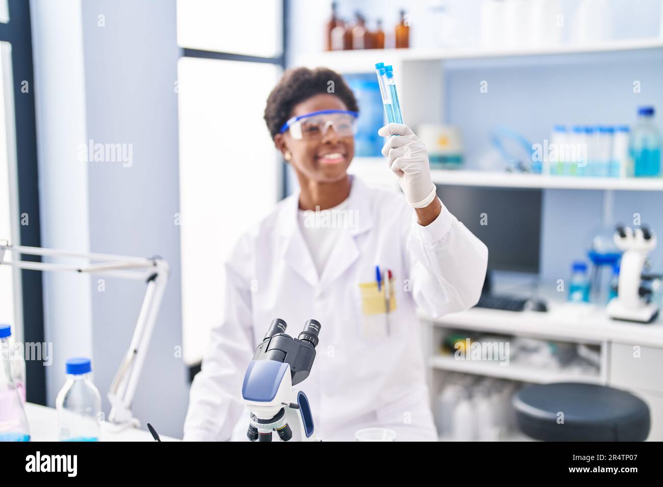 African american woman wearing scientist uniform write on clipboard ...