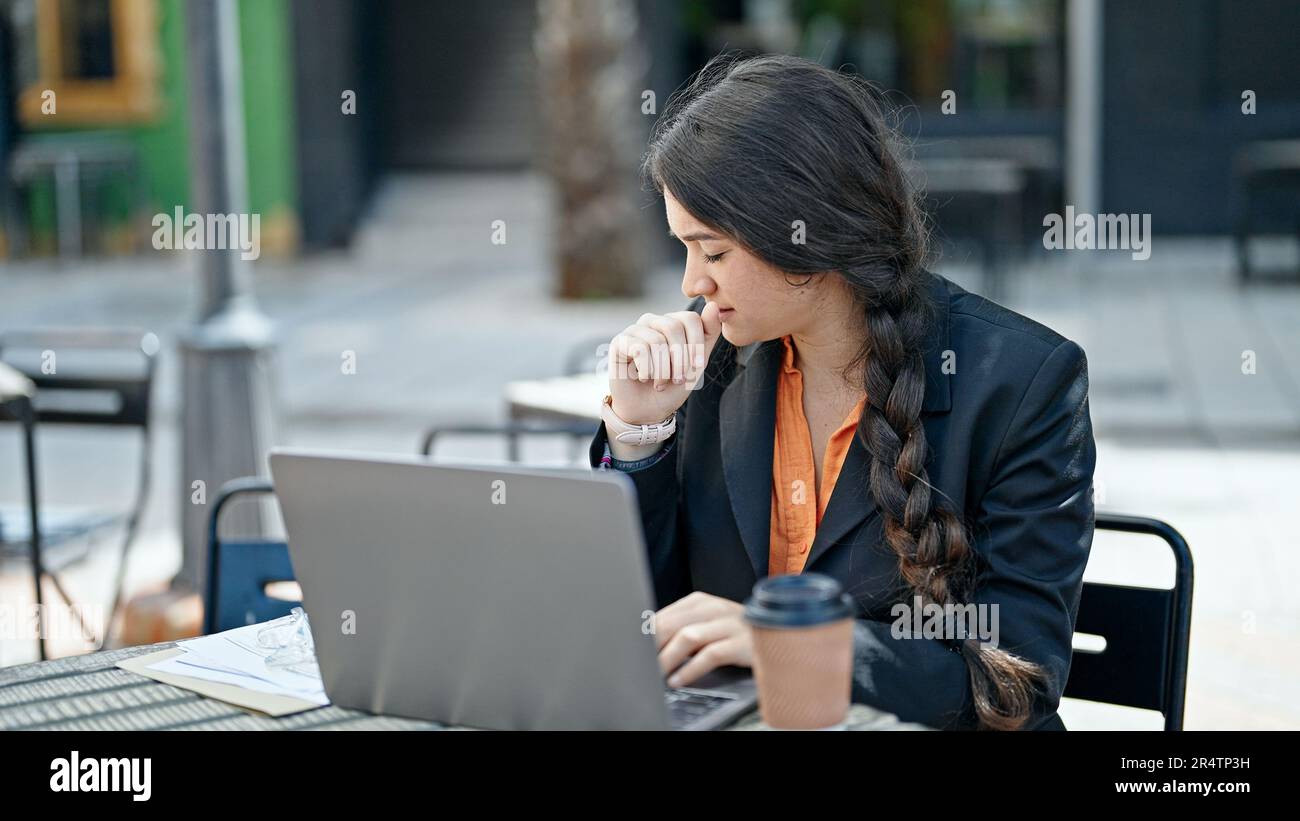 Sick businesswoman coughing sitting outdoor hi-res stock photography ...