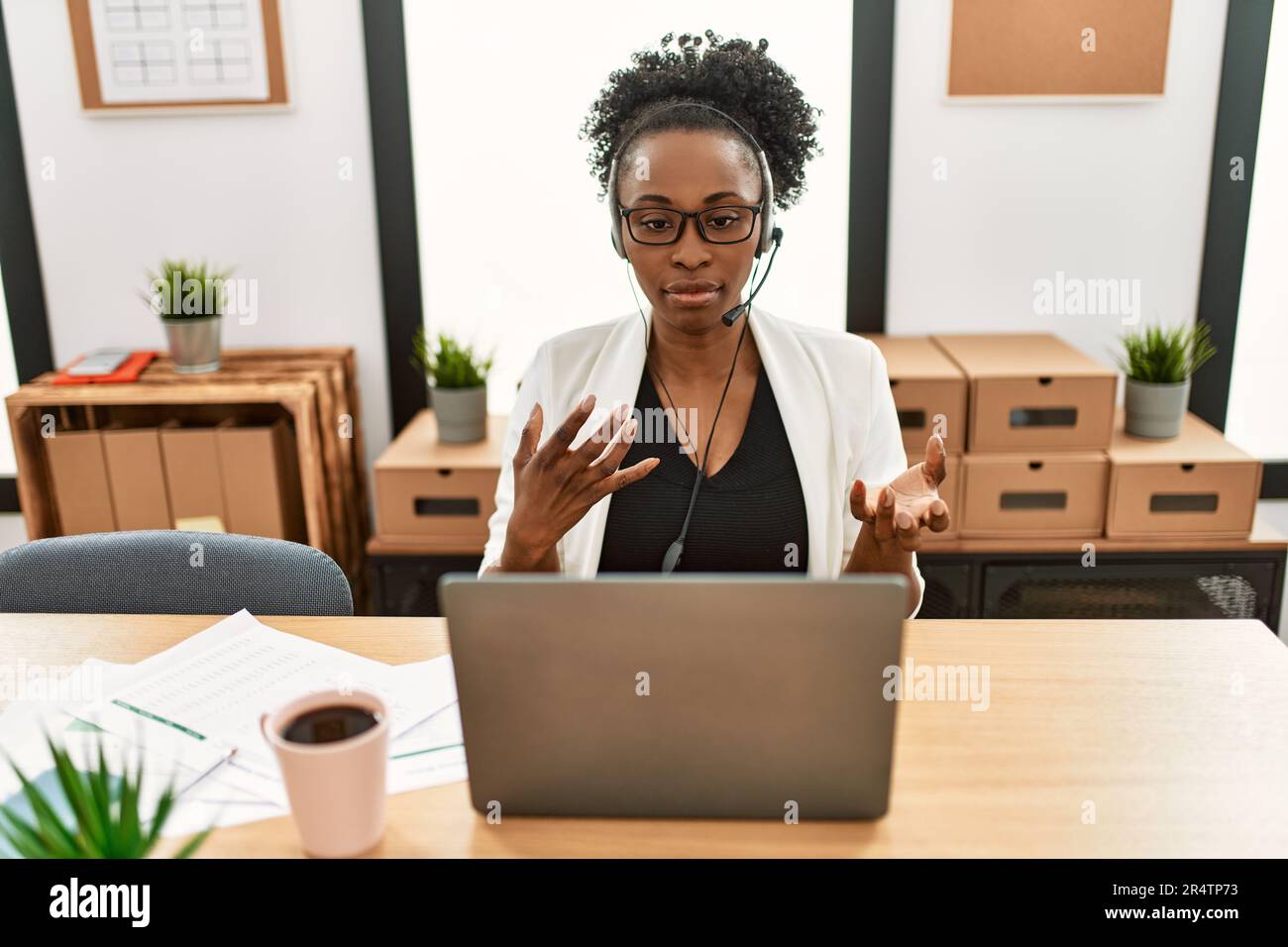African american woman call center agent speaking at office Stock Photo ...