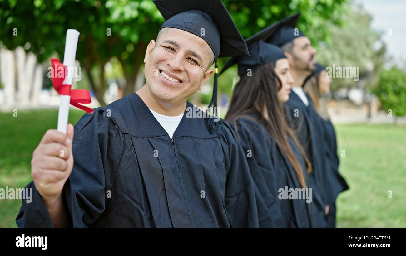 Group of people students graduated holding diploma at university campus ...