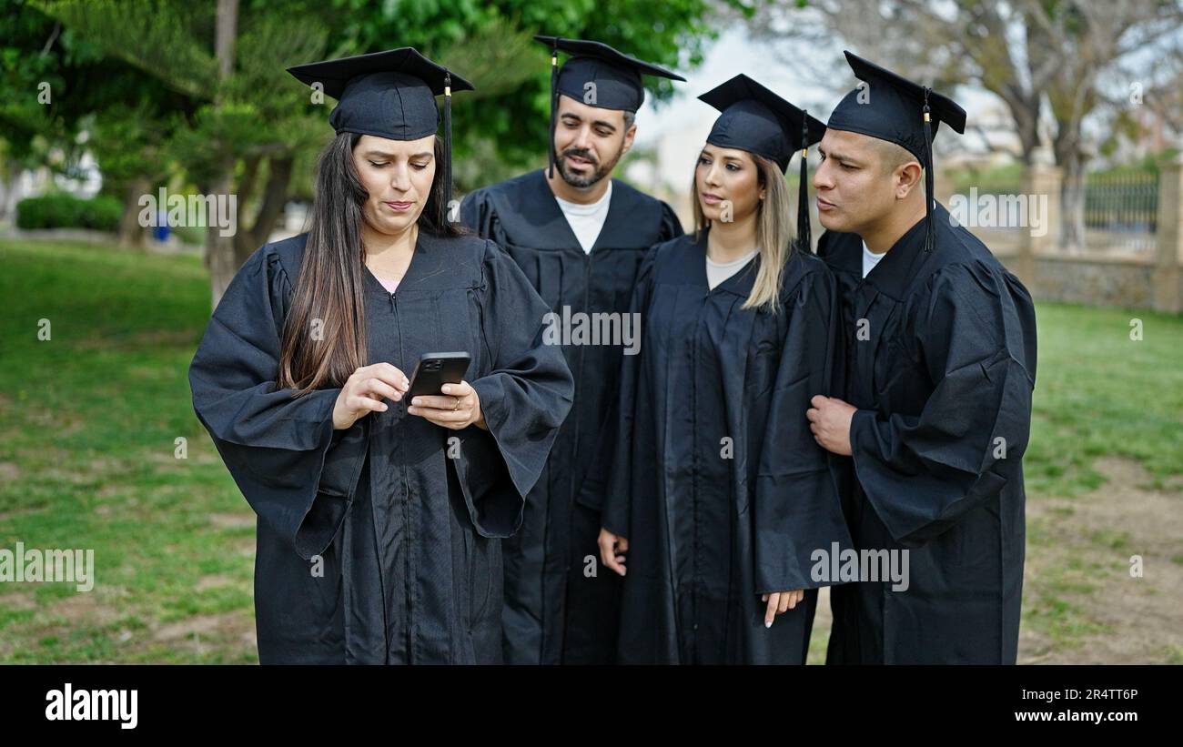 Group of people students graduated using smartphone at university ...